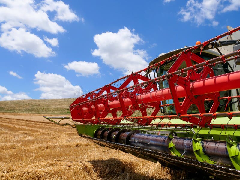 Combine Harvester Parked in a Large Wheat Field. Stock Image - Image of ...