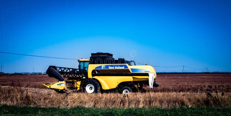 Combine Harvester Under a Blue Sky Editorial Stock Image - Image of ...