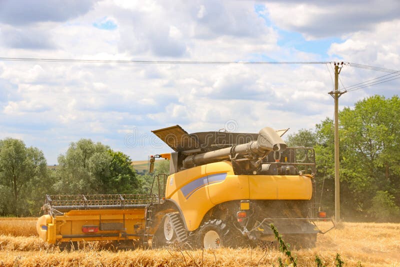 Combine Harvester at work stock photo. Image of machine - 209692952