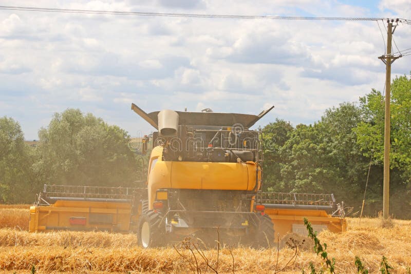Combine Harvester at work stock photo. Image of harvesting - 210244534