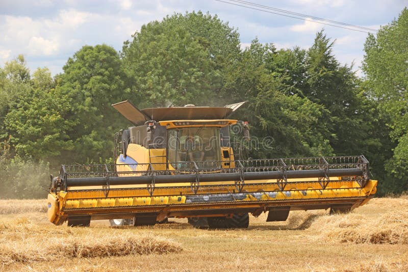 Combine Harvester at work stock image. Image of farm - 210803451