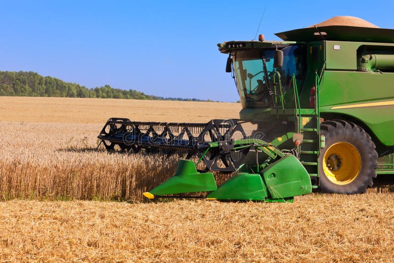 Combine harvester working stock image. Image of agricultural - 84701999