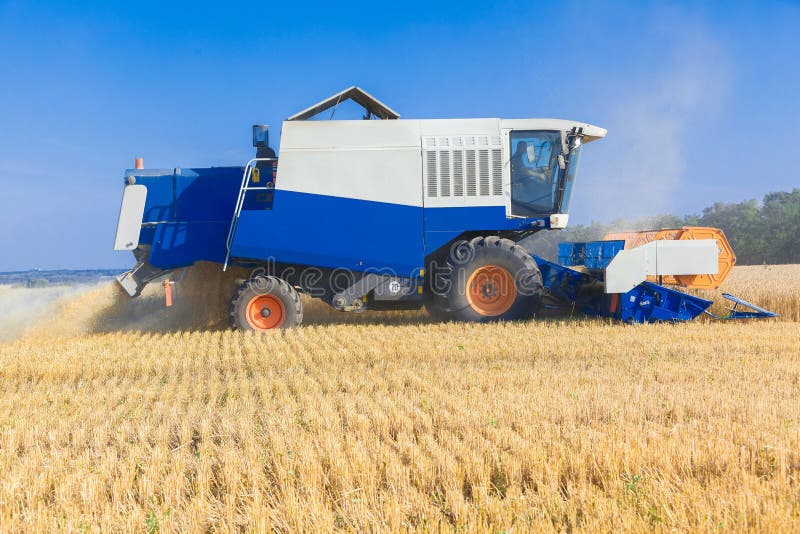 Combine harvester working stock photo. Image of industry - 50240874