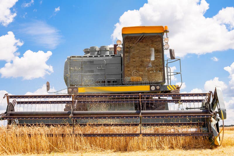 Combine Harvester Working on a Wheat Field. Stock Photo - Image of ... Combine Harvester Working on a Wheat Field. Stock Photo - Image of ...