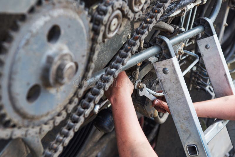 Man Repairing a Combine Harvester Stock Photo - Image of harvesting ...