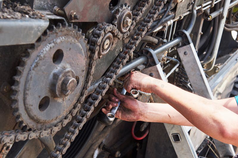 Man Repairing a Combine Harvester Stock Photo - Image of harvesting ...