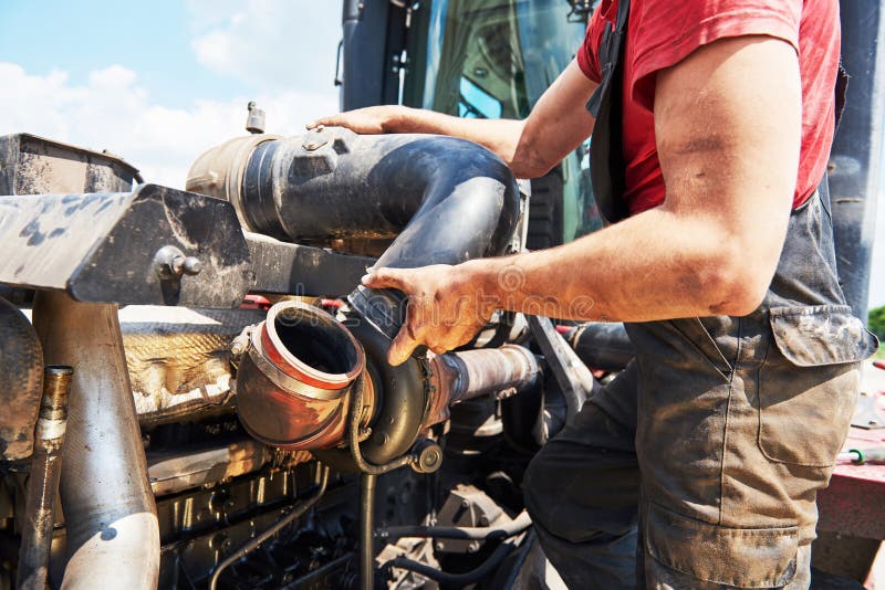 Man Repairing a Combine Harvester Stock Photo - Image of harvesting ...