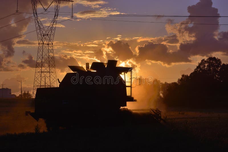 Combine at sunset stock image. Image of combines, country - 32362523