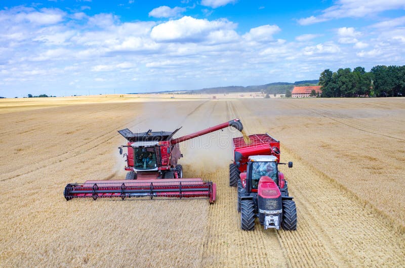 Combines And Tractors Working On The Wheat Field Stock Photo - Image ...