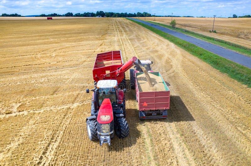 Combines and Tractors Working on the Wheat Field Stock Photo - Image of ...