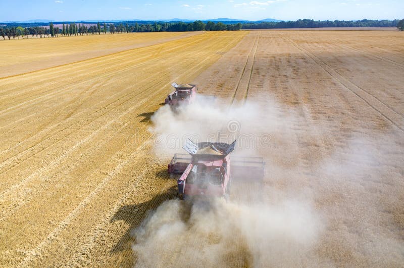 Combines and Tractors Working on the Wheat Field Stock Photo - Image of ...