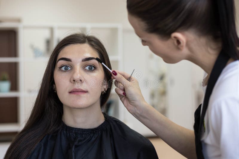 Combing the Eyebrows with a Special Brush Stock Photo - Image of ...