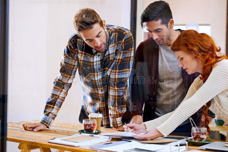 Combining Their Creative Powers. a Team of Young Designers Working ...