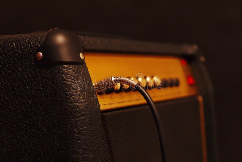 Combo Amplifier for Electric Guitar with Inserted Input Jack on Black ...