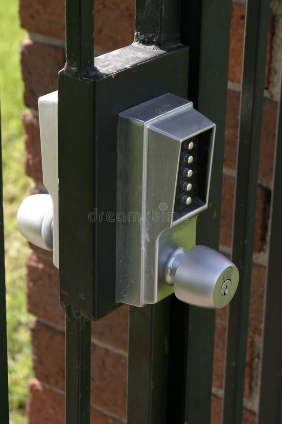 Combo lock on a gate stock image. Image of metal, brick - 588785