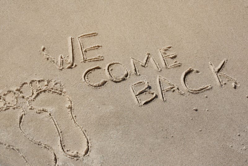 We Come Back - Written by Hand in Sand on a Sea Beach, with a Soft Wave ...