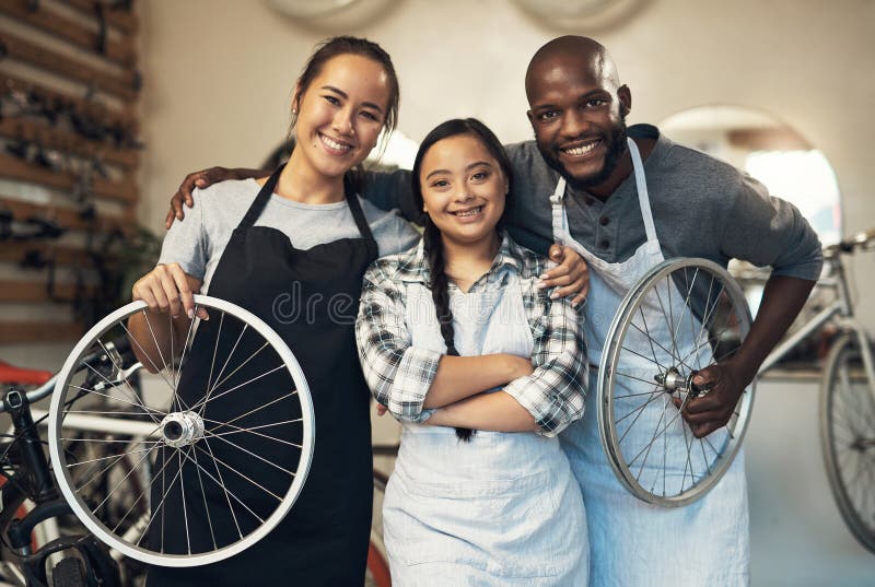 Come Inside. Portrait of Three Young Workers at a Bicycle Repair Shop ...