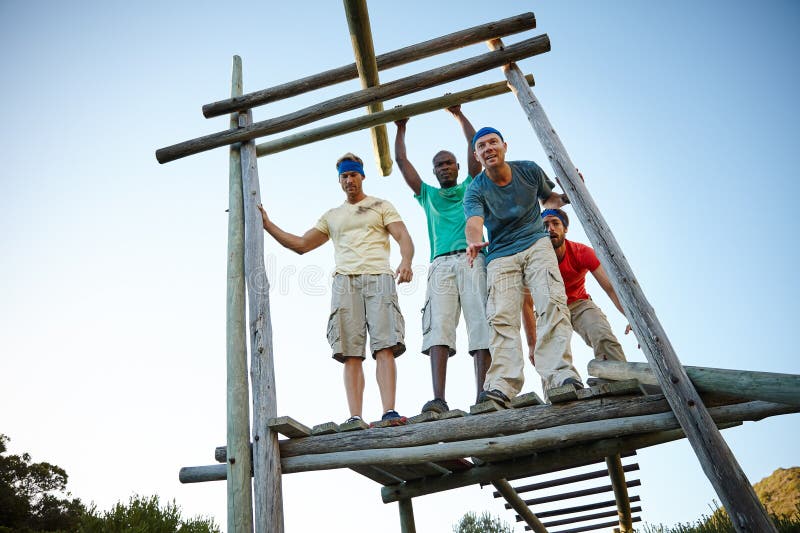 Come on, You Can Do it. a Group of Men Going through an Obstacle Course ...
