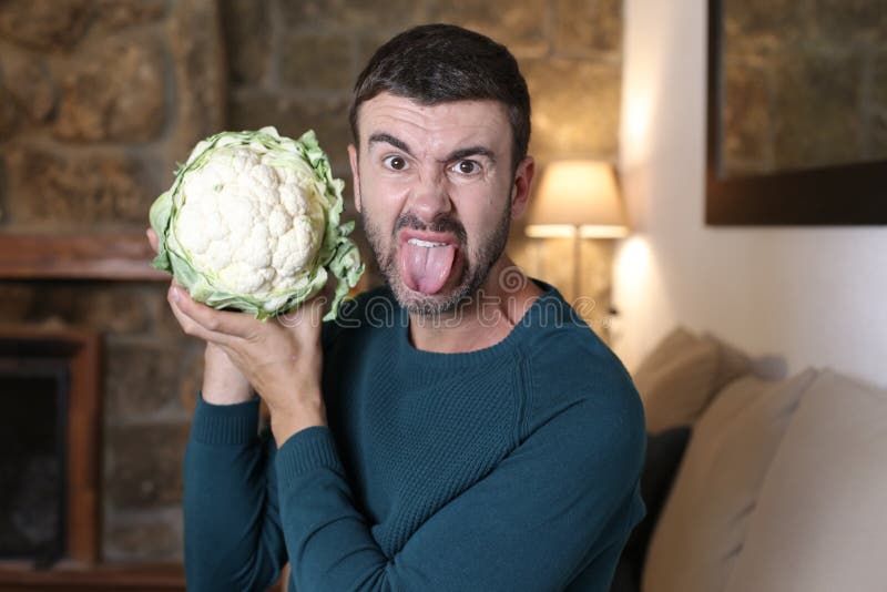 Comedic Image of Man Disliking a Raw Cauliflower Stock Photo - Image of ...