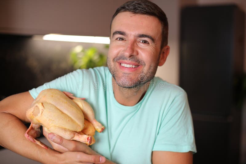 Comedic Image of Man Holding a Chicken with Tenderness Stock Photo ...