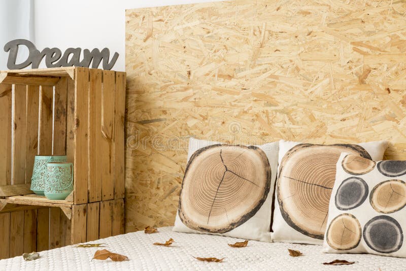 Comfortable Bed with Nature Themed Cushions Stock Photo - Image of wood ...