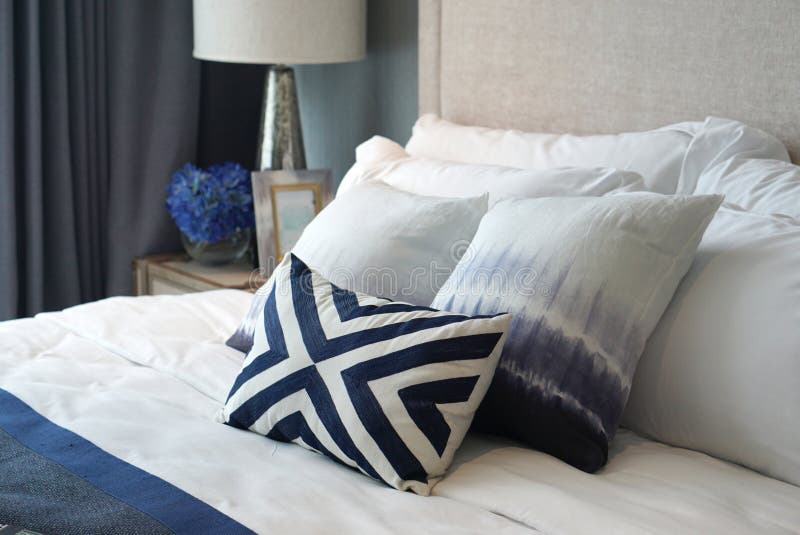 Comfortable Blue Pattern Cushions and White Pillows on the White Stock ...