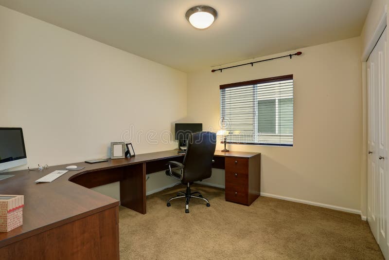 Comfortable Home Office Interior with Large Brown Desk and Carpet Floor ...