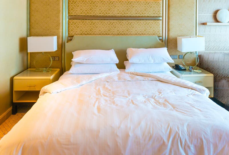 Comfortable Hotel Bed stock image. Image of interior - 103106717