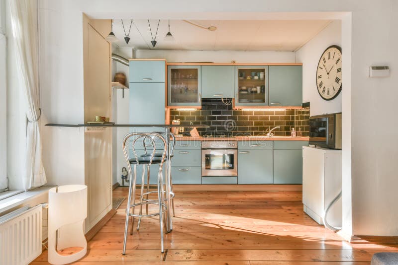 Comfortable Kitchen with a Pale Kitchen Set Stock Photo - Image of ...