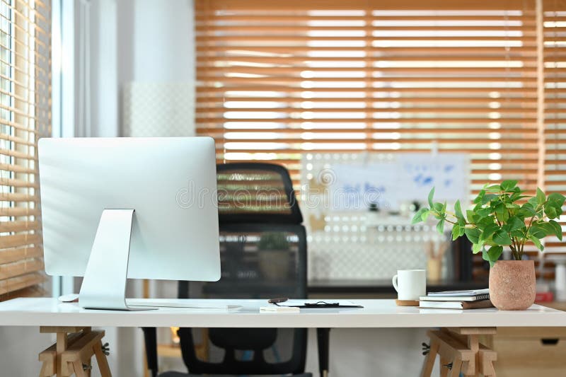Comfortable Office Interior with Computer Monitor, Cup of Coffee ...