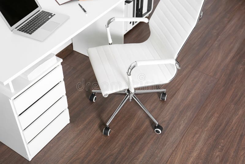 Comfortable Rolling Chair Near Table with Laptop in Office Stock Photo ...