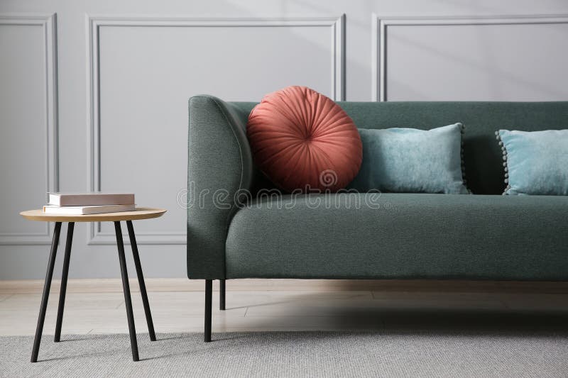 Comfortable Sofa and Side Table Near Grey Wall in Room Stock Photo ...
