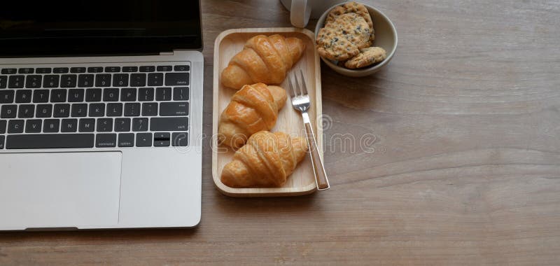 Comfortable Workplace with Laptop Computer and Breakfast on Wooden ...
