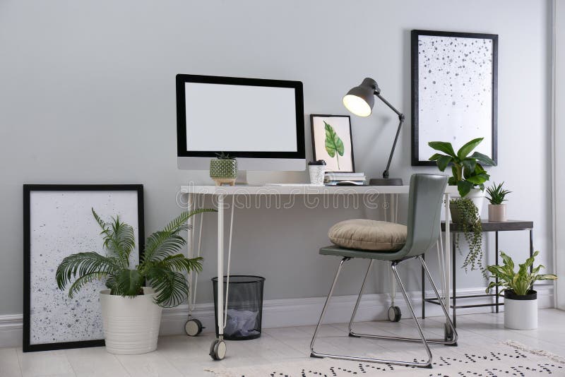 Comfortable Workplace with Modern Computer and Houseplants in Room ...