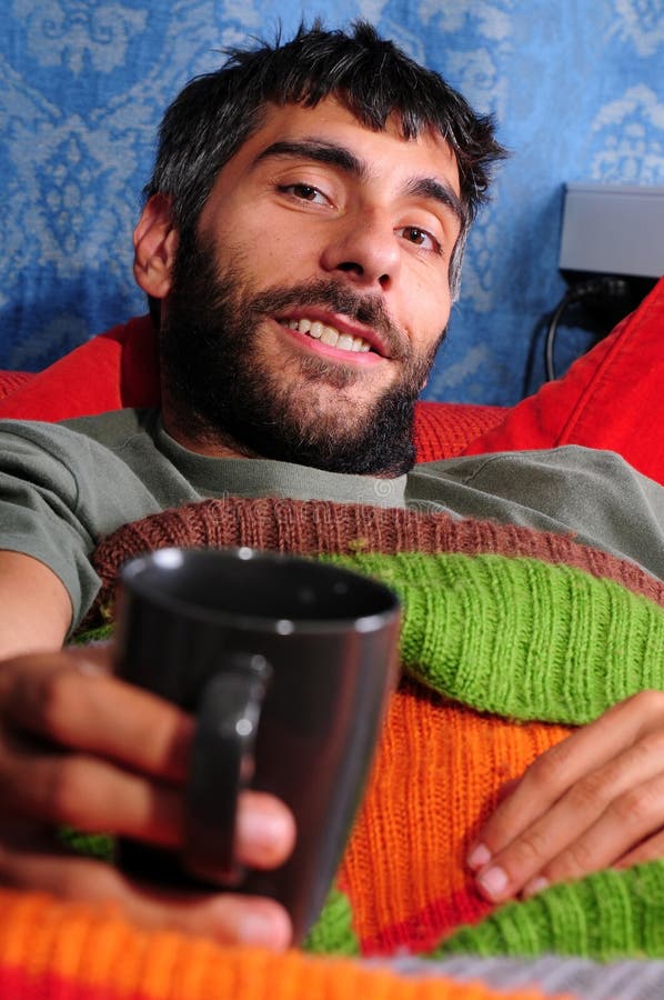 Comfy Man on the Couch Offering His Mug Stock Image - Image of person ...
