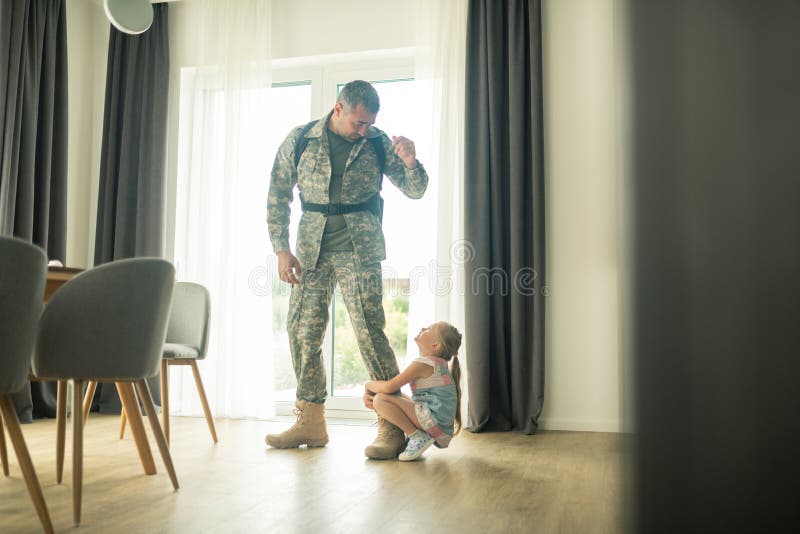 Serviceman Calming His Daughter Down while Coming Back Soon Stock Image ...