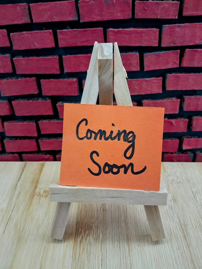 Coming Soon Message on a Wood Easel Stock Photo - Image of information ...