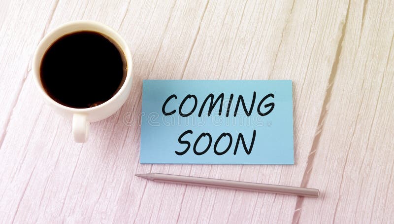 COMING SOON Text on the Blue Sticker with Cofee and Pen Stock Image ...
