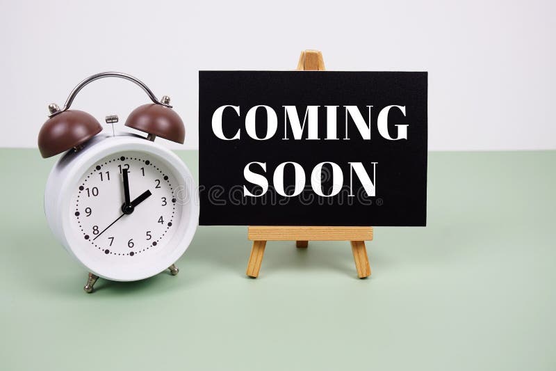 Coming Soon Text on Paper Card with Alarm Clock on Green Background ...