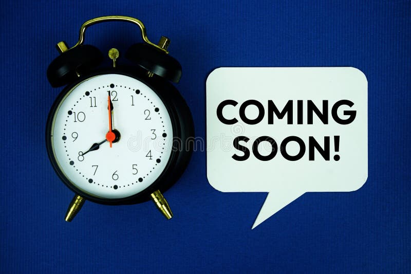 Coming Soon Text on Speech Bubble with Alarm Clock Top View on Blue ...