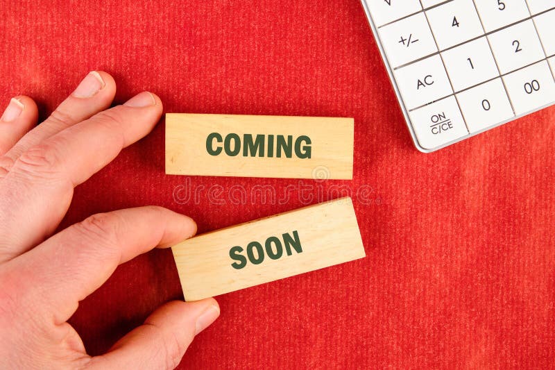 Coming Soon Text Written Made Up of Blocks with the Help of a Hand on a ...