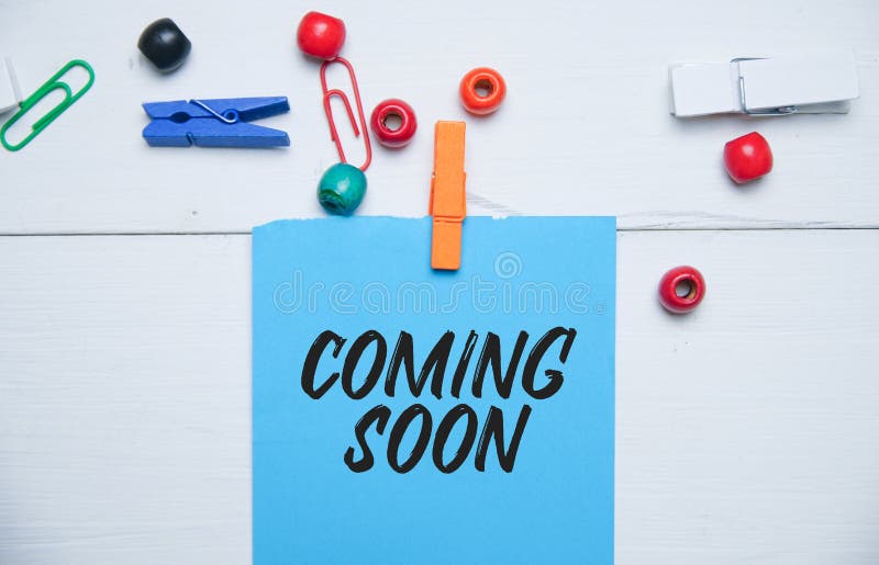COMING SOON Word on Stick it Note Over Wooden Background. Stock Image ...