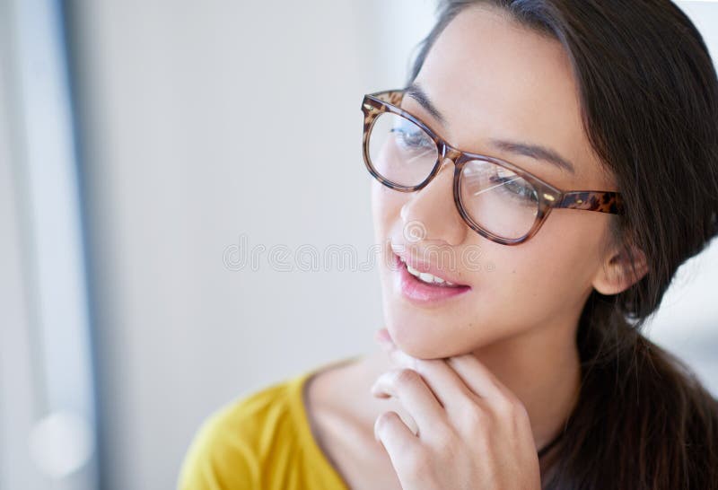 Coming Up with Another Bright Idea. an Attractive Young Woman in an ...