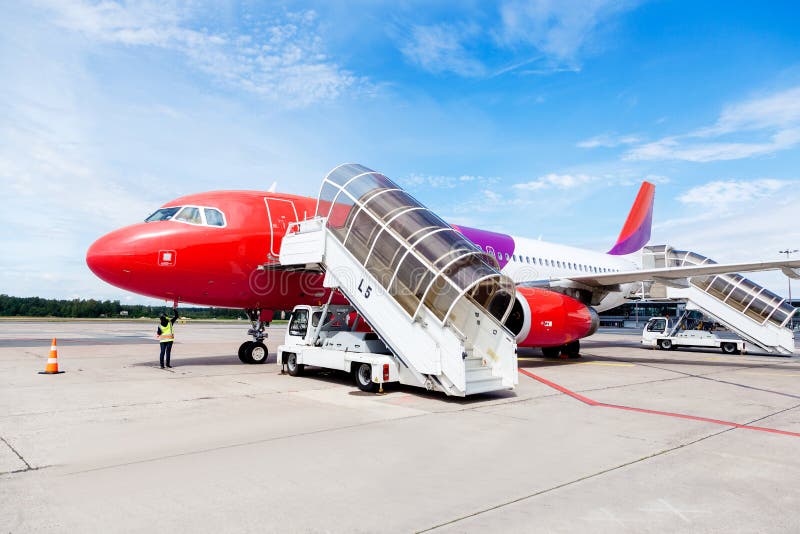 Commercial Airplane with Connected Boarding Ramp Stock Image - Image of ...