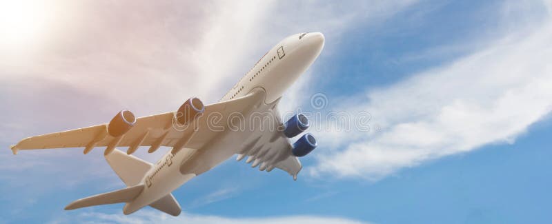 Commercial Airplane Flying Above Clouds in Dramatic Sunset Light. Very ...