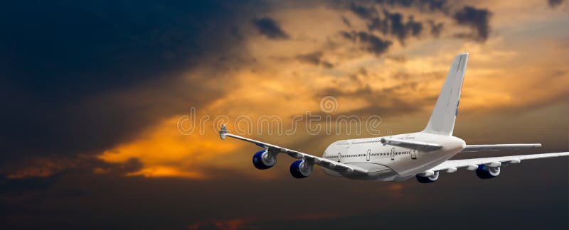 Commercial Airplane Flying Above Clouds in Dramatic Sunset Light. Very ...