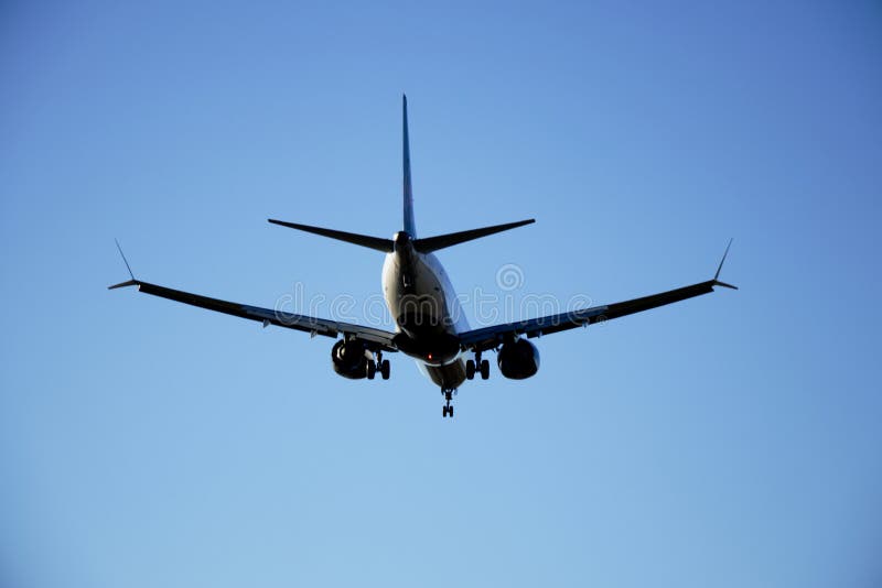 Commercial Airplane Landing - Low Angle Back View Stock Image - Image ...