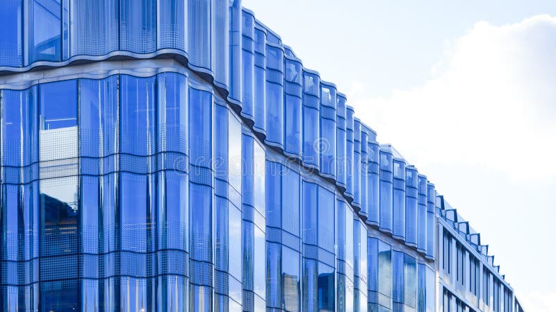 Commercial Blue Glass Skyscraper with Mirrored Facade in Financial ...