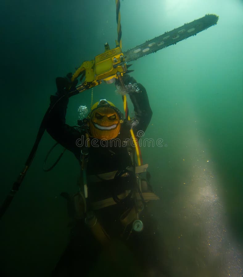 Commercial Diver Cutting Log Underwater with Chainsaw Stock Image ...