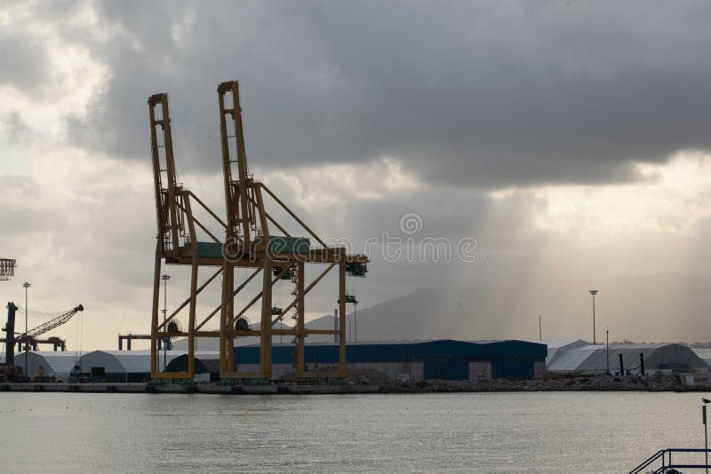 Commercial Harbor with Dark Clouds and a Sunlight Stock Photo - Image ...